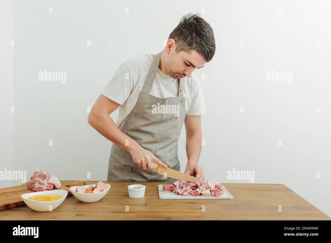 Man cutting meat hi-res stock photography and images - Alamy
