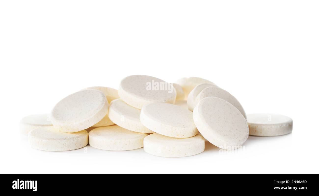 Pile of vitamin pills on white background Stock Photo - Alamy
