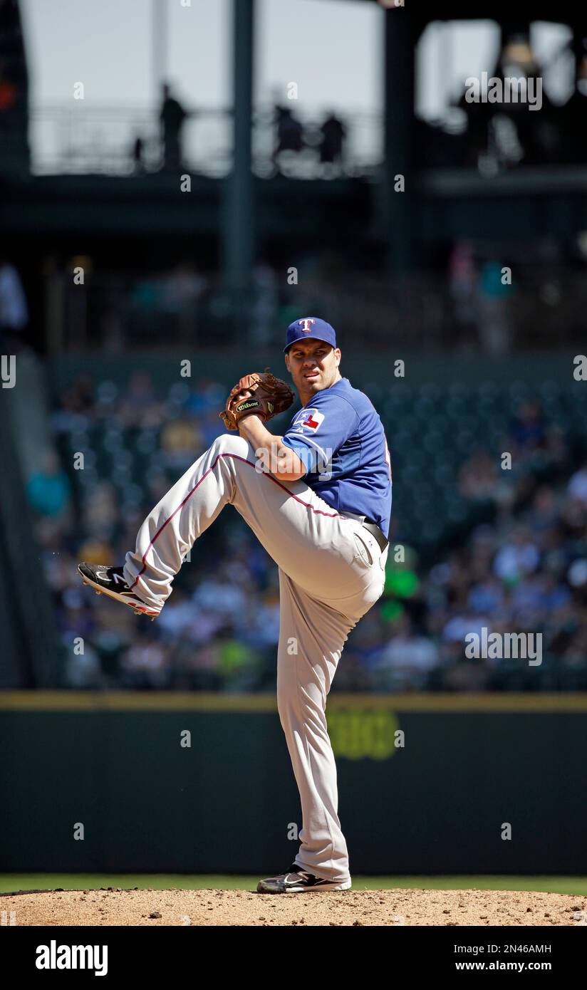 Texas Rangers starting pitcher Colby Lewis in action against the ...