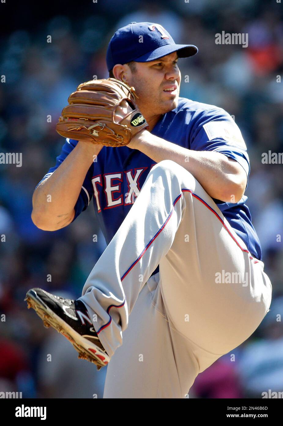 Texas Rangers starting pitcher Colby Lewis throws against the Seattle ...