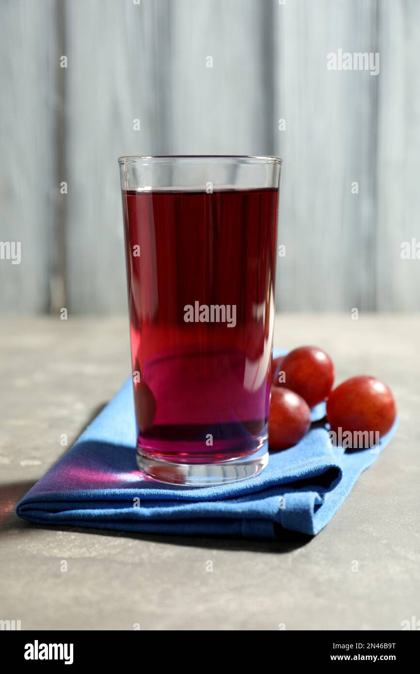 Delicious grape soda water grey table. Refreshing drink Stock Photo - Alamy