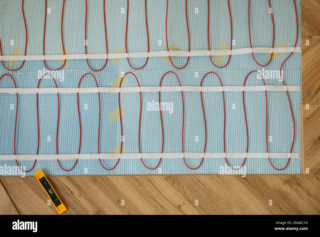 Installation of electric underfloor heating system indoors, top view ...