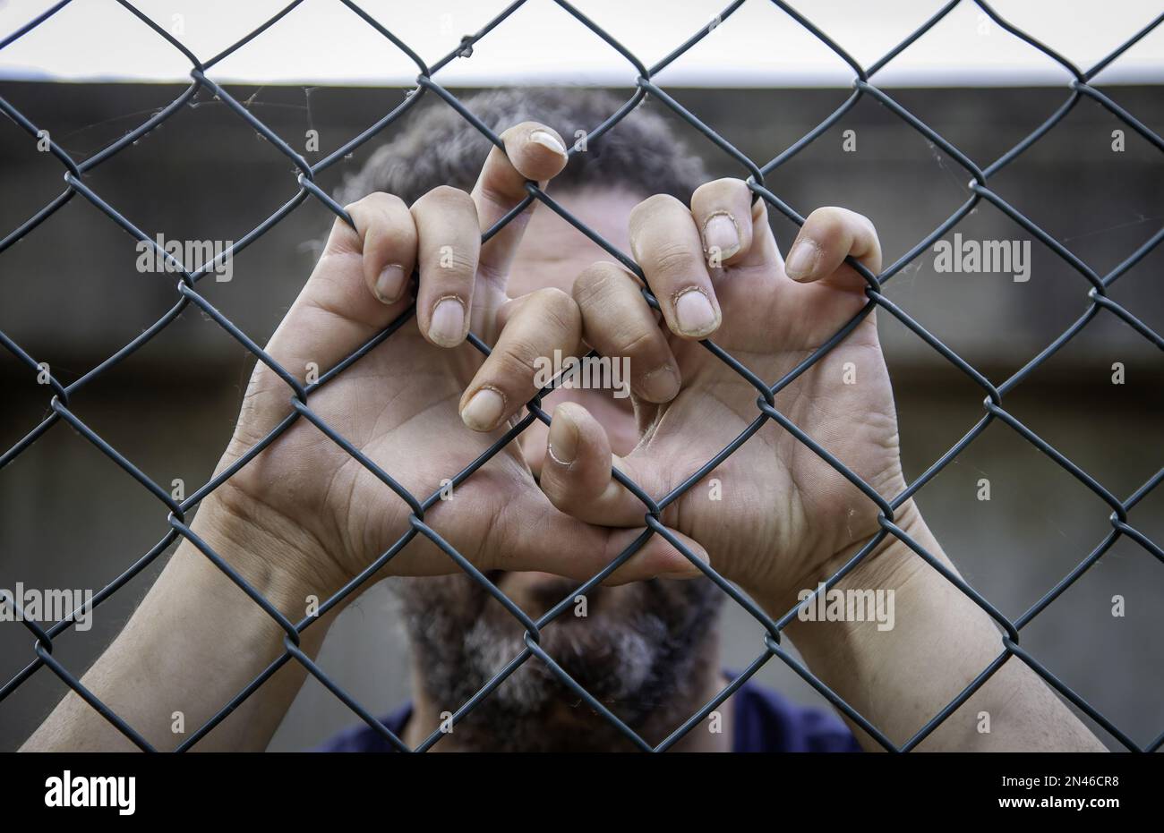 Detail of man prisoner and captured in jail Stock Photo - Alamy