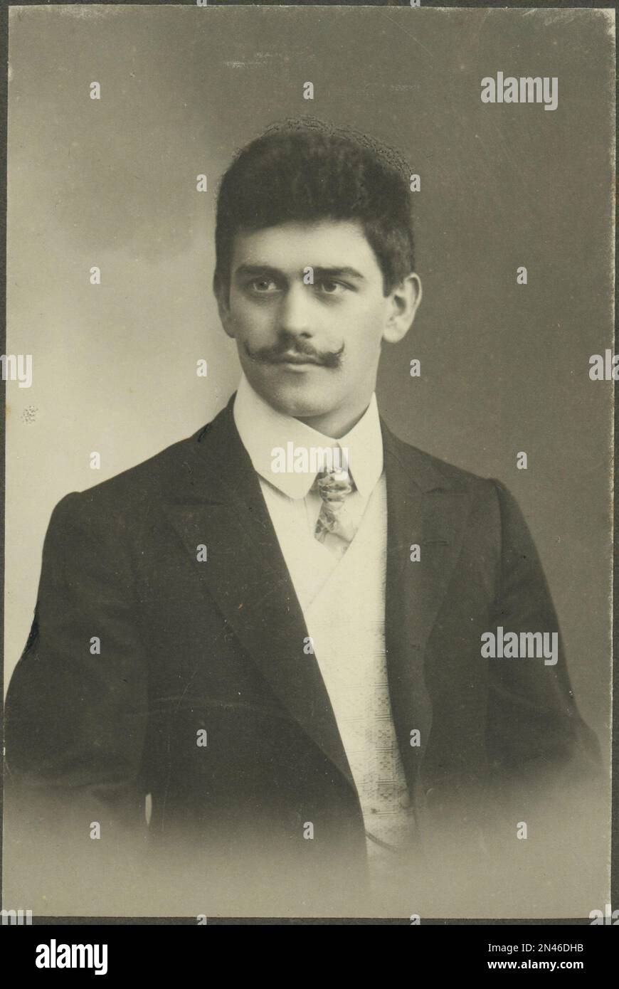 Old photo taken in Germany around 1900. A young man with dark hair and ...