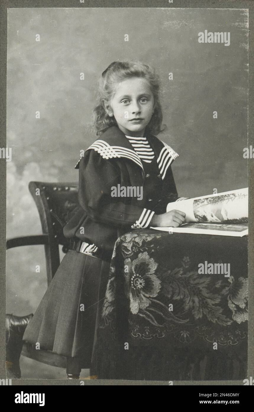 Old photo taken in Germany around 1900. A lovely romantic girl, looking ...