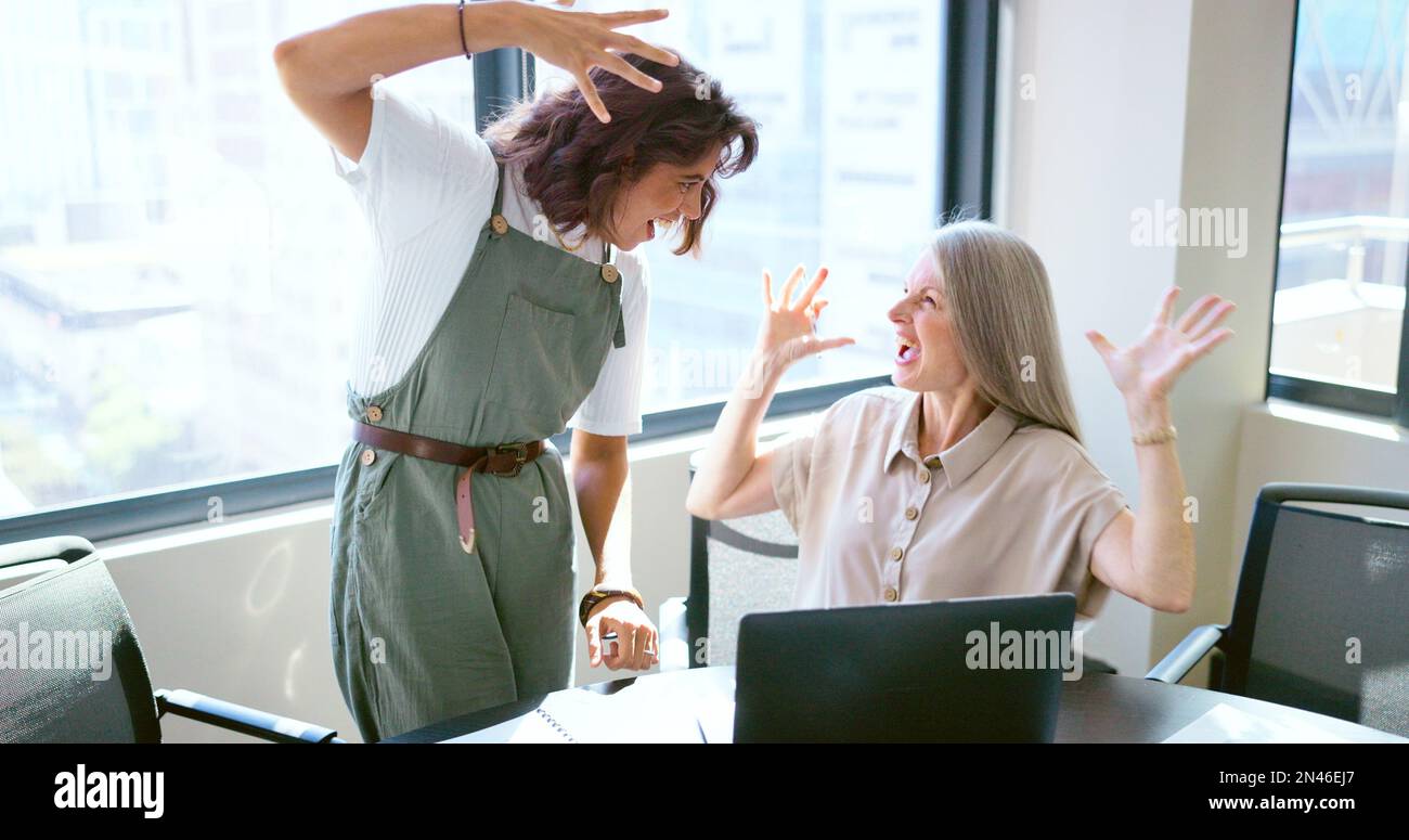 Success, handshake and business women with a laptop, celebrate win and ...