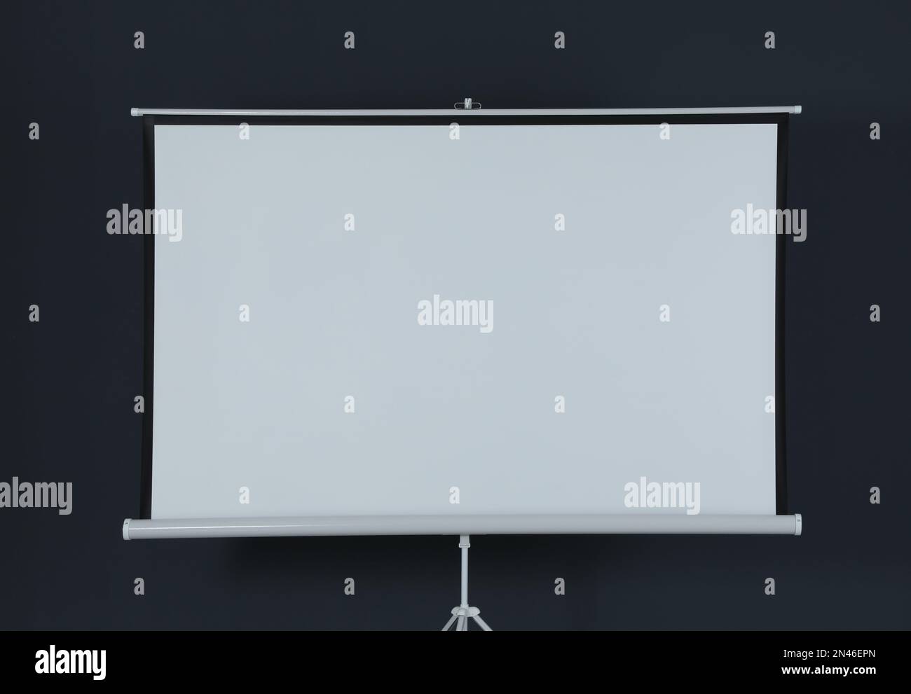 Blank projection screen near black wall indoors. Space for design Stock ...