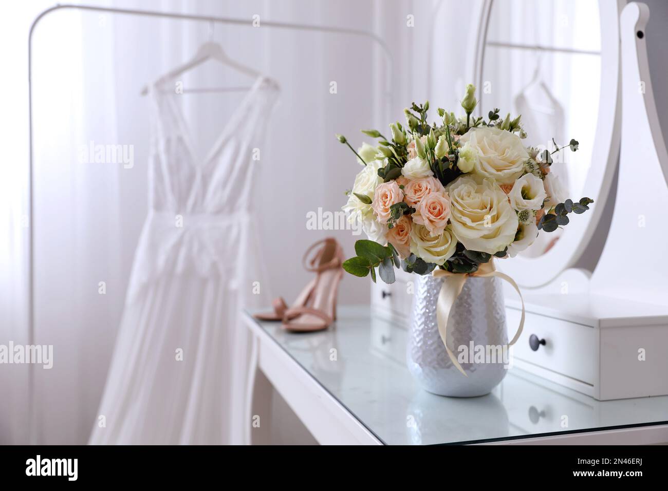 Beautiful wedding bouquet on dressing table indoors Stock Photo - Alamy