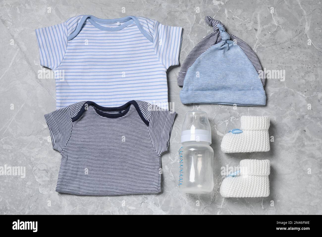 Flat lay composition with cute baby items on grey background Stock ...