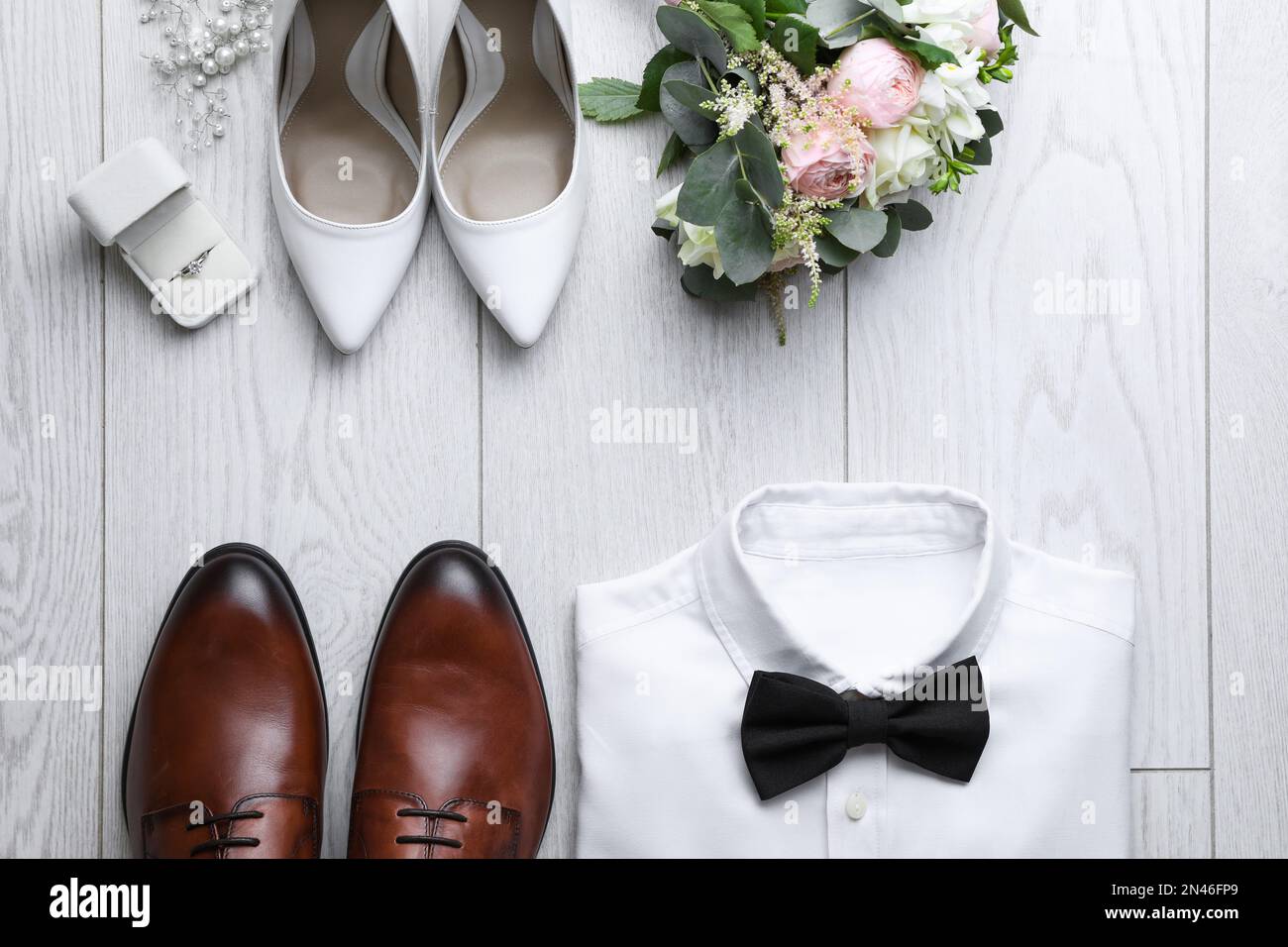Flat lay composition with wedding shoes for bride and groom on white ...