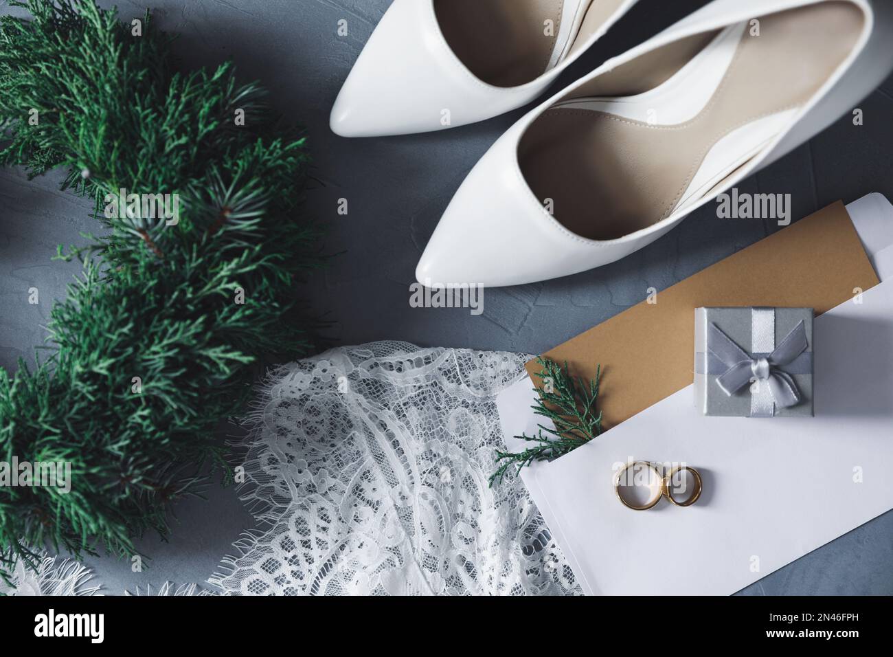 Flat lay composition with wedding dress, white high heel shoes and ...
