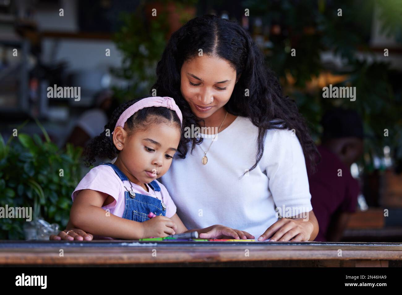 Drawing, learning and mother with girl at cafe, studying and art ...