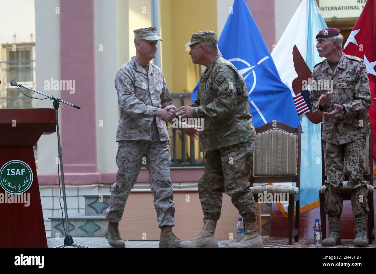 Outgoing commander of ISAF, U.S. Gen. Joseph Dunford, left, shakes ...