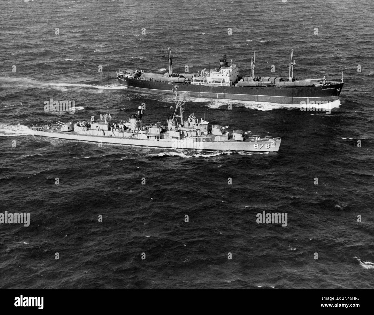 The USS Vesole, foreground, a radar picket ship, steams alongside the ...