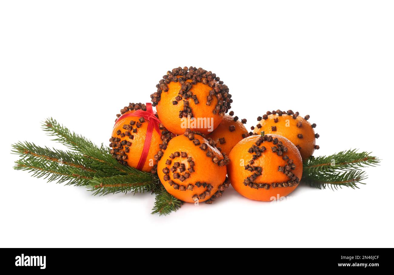 Pile of pomander balls made of fresh tangerines with cloves on white ...