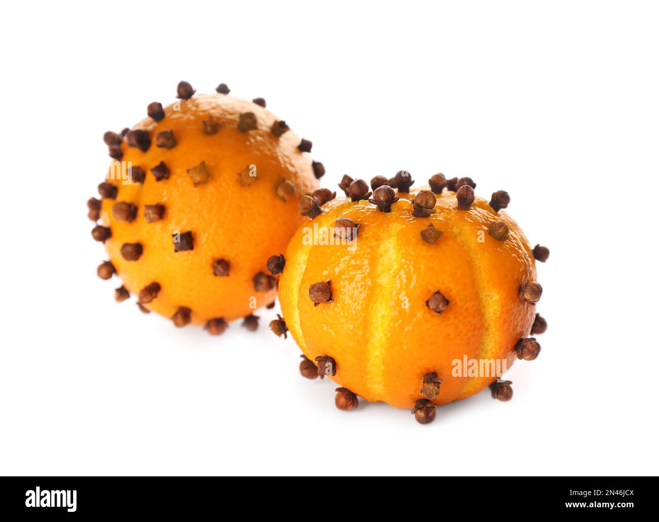 Pomander balls made of fresh tangerines and cloves on white background ...