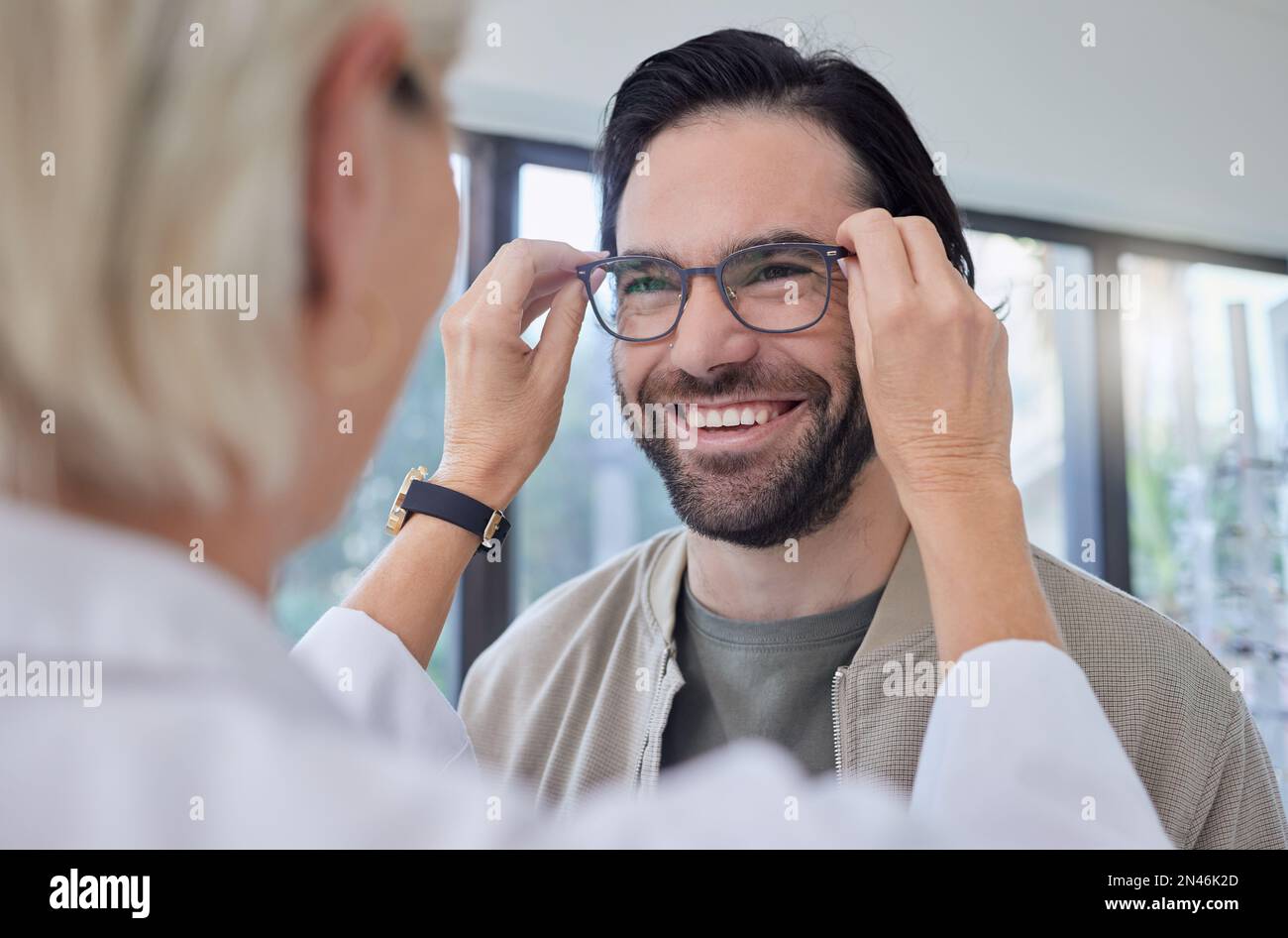 Optometrist, glasses and man with smile in store for vision, eyesight ...
