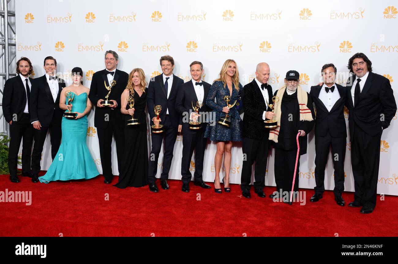 The cast and crew of “The Normal Heart” pose in the press room with the ...