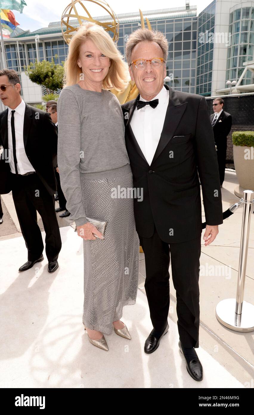 Lezlie Johnson, left, and Mark Johnson arrive at the 66th Primetime ...