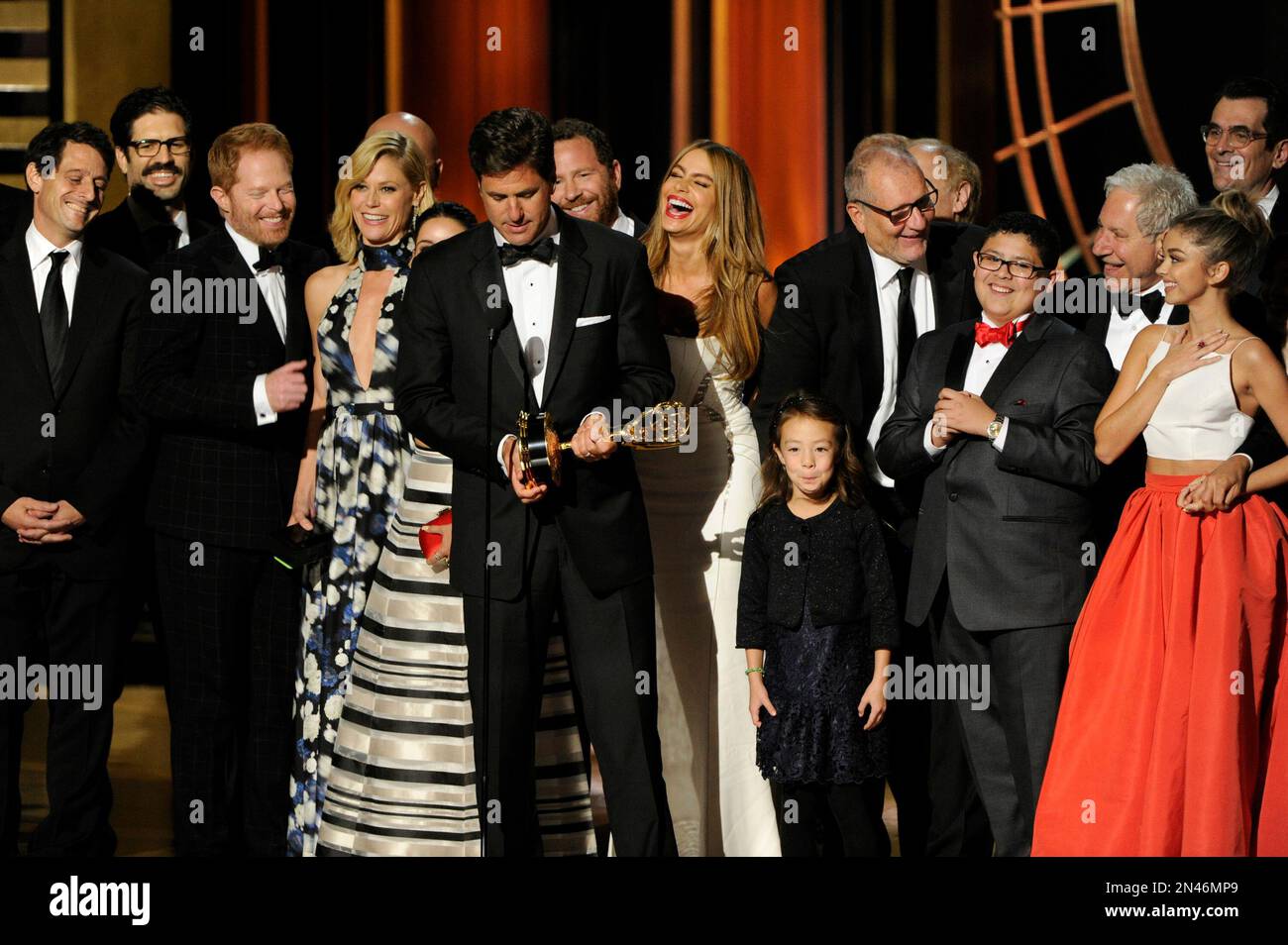 Steven Levitan, center, and the producers of “Modern Family” accept the ...