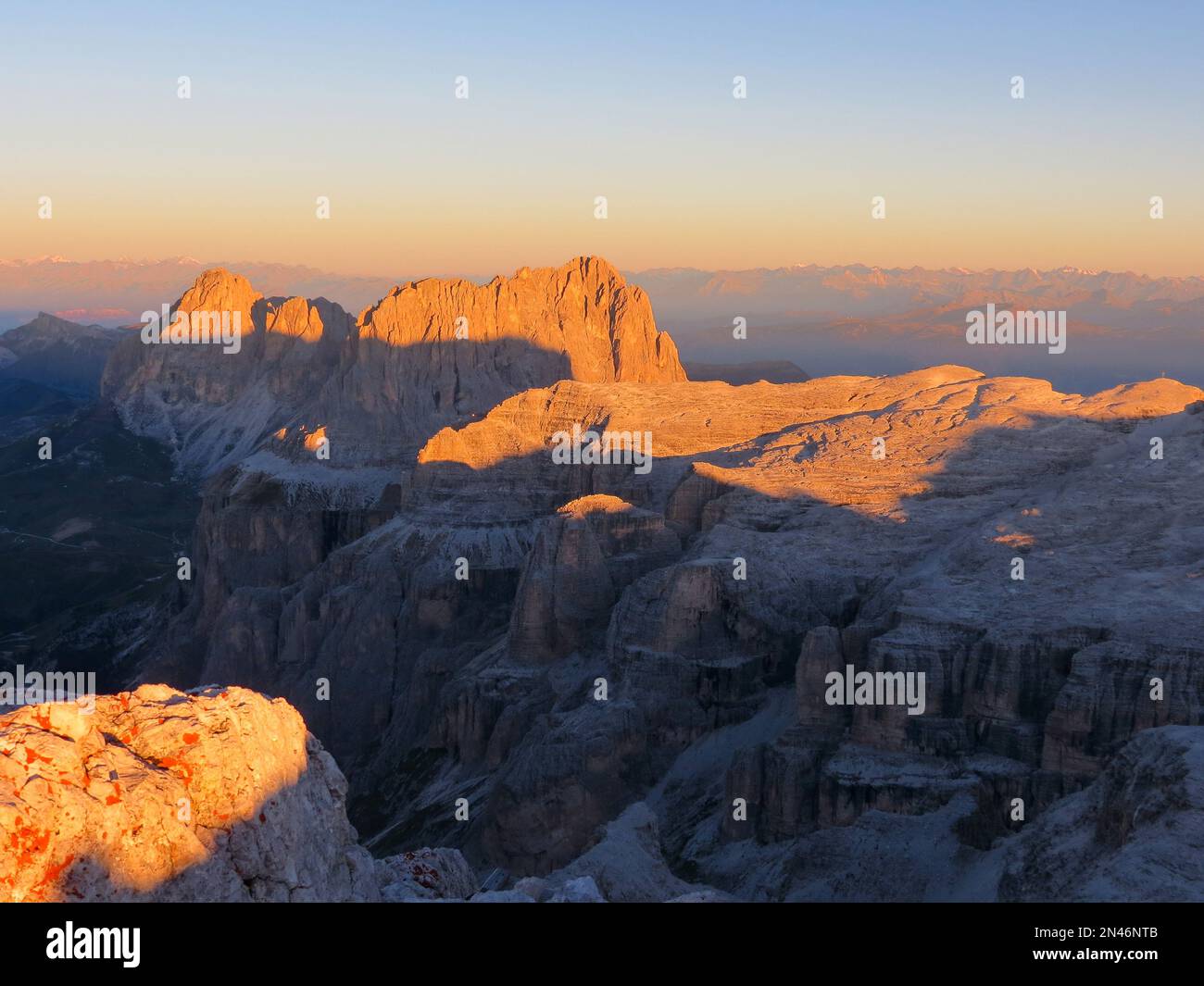 Alpenglow at sunrise on the Sassolungo and Sella mountain groups. The ...