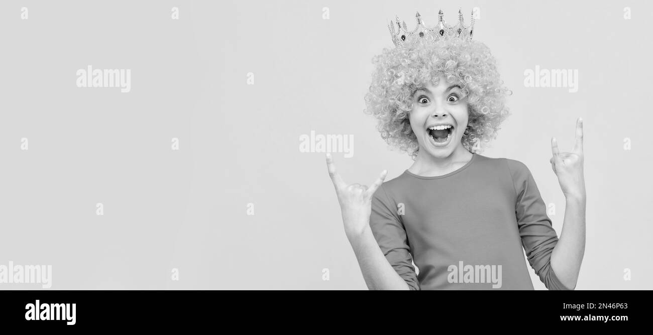 happy selfish child girl in curly wig and princess diadem, happiness ...