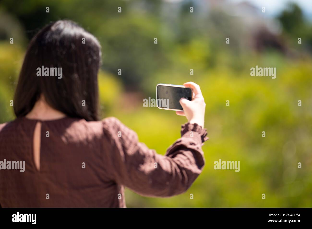 Girl video calling her friends on a zoom call. Woman on holiday skyping ...