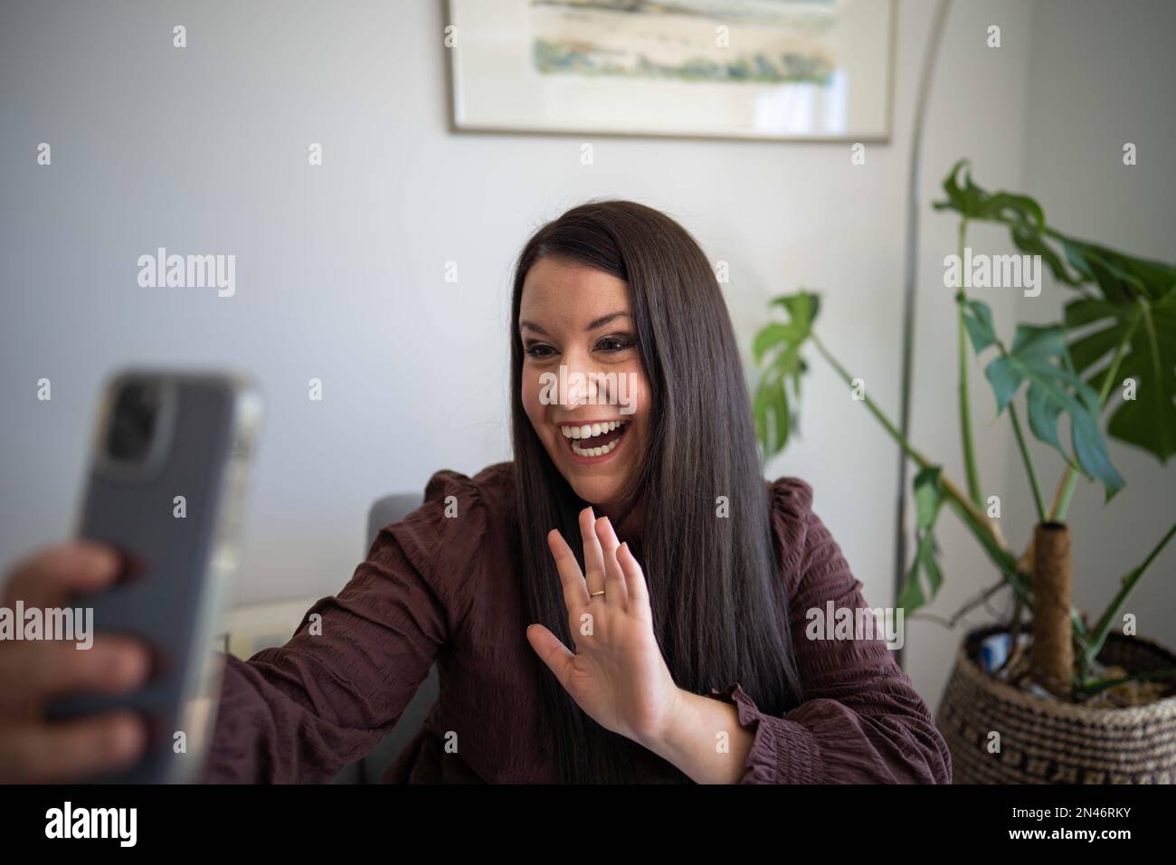 Girl video calling her friends on a zoom call. Woman on holiday skyping ...