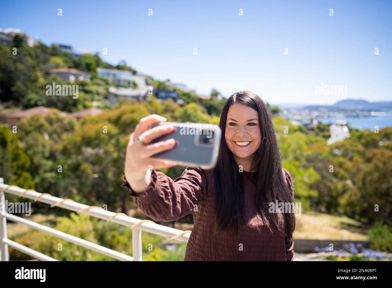 Girl taking a selfie on holiday in australia. Business Woman taking a ...