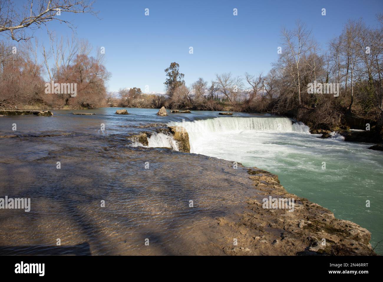 The surface of the water turning into a waterfall Stock Photo - Alamy