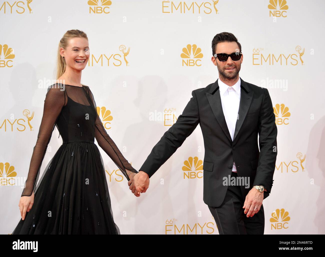 Behati Prinsloo, left, and Adam Levine arrive at the 66th Annual ...