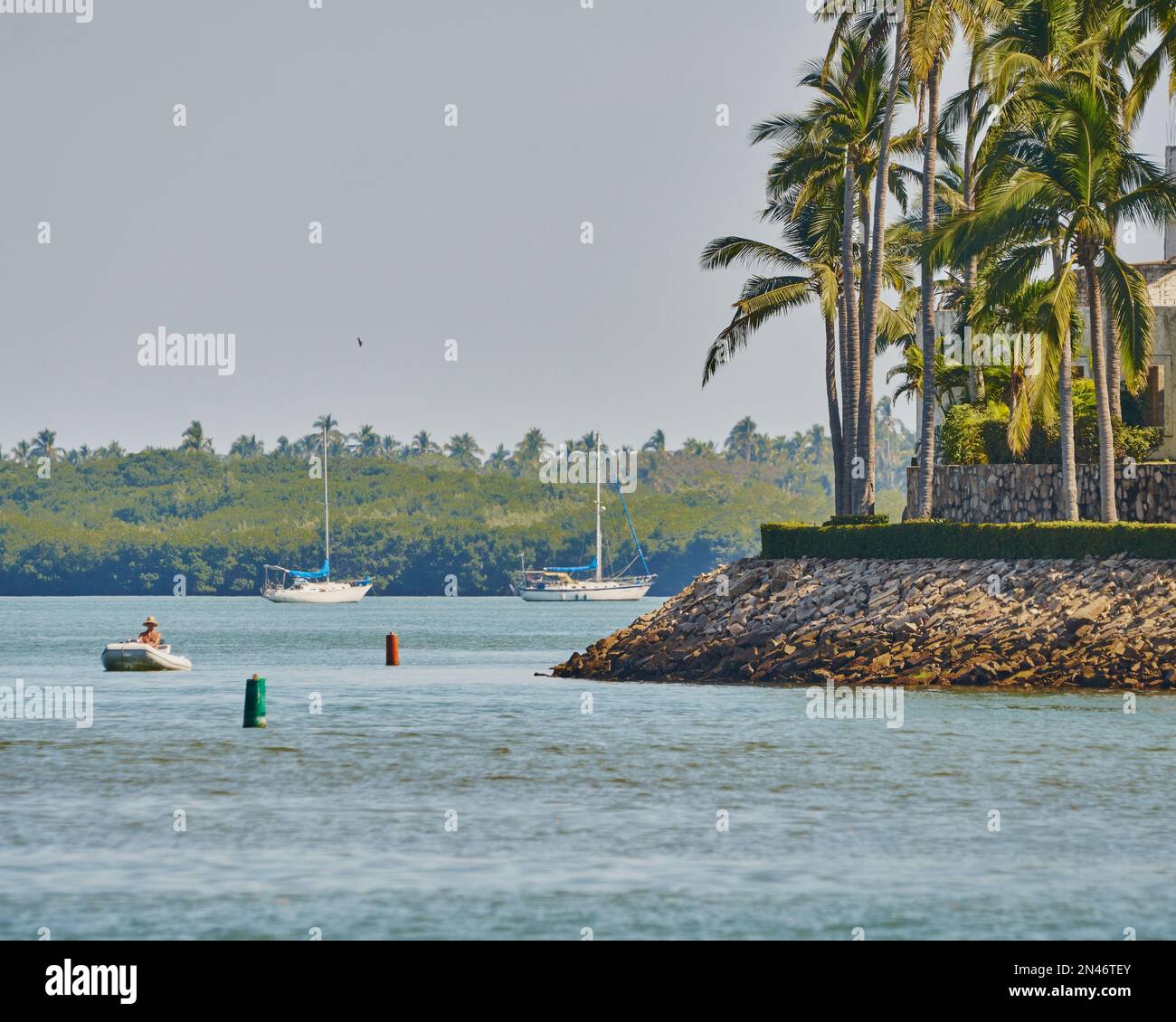 very large luxury hotel located in the middle of palm trees and right ...