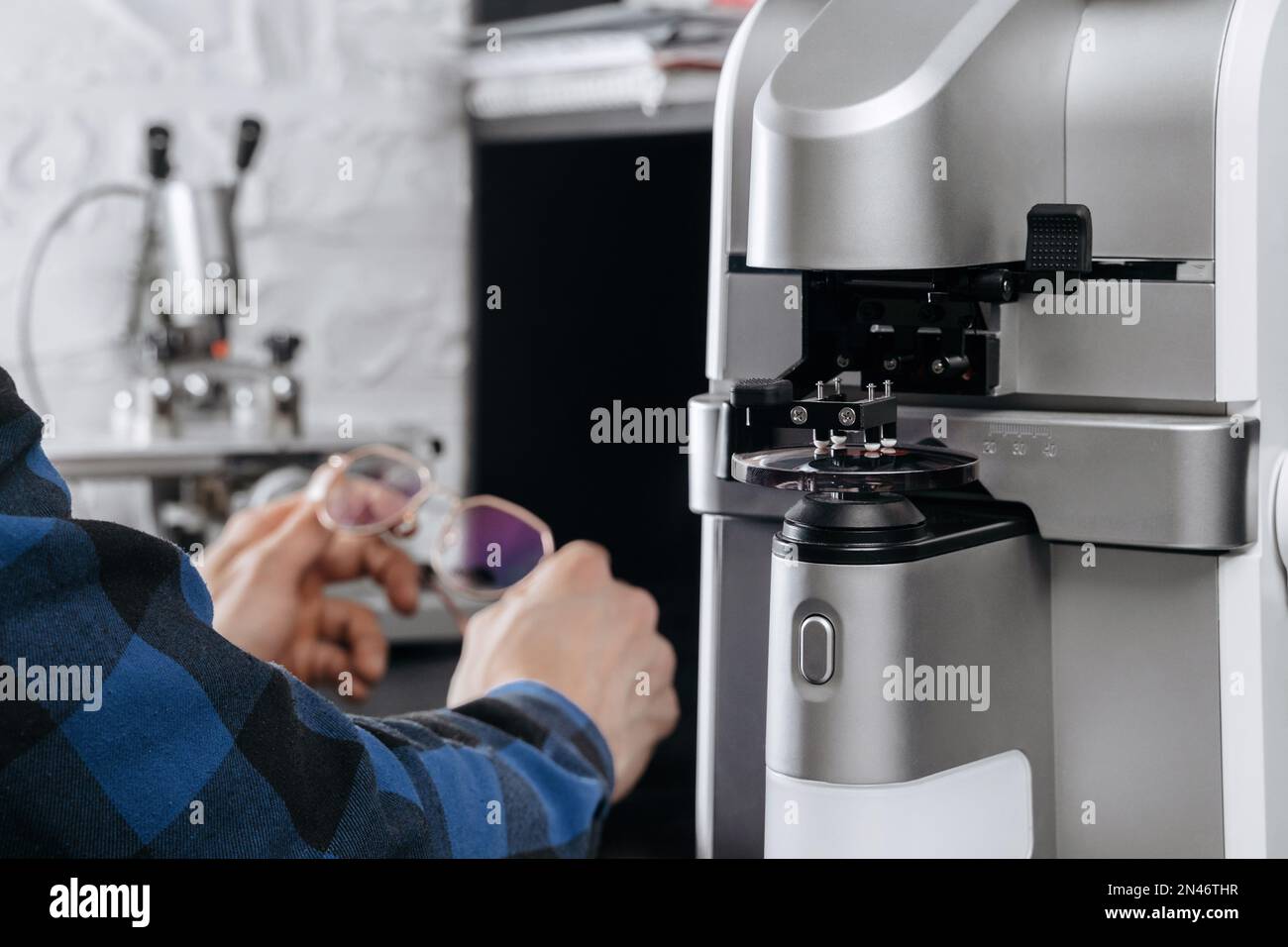 Manufacturing glasses lenses hi-res stock photography and images - Alamy