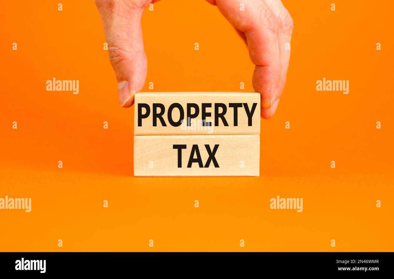 Property tax symbol. Concept words Property tax on wooden blocks ...