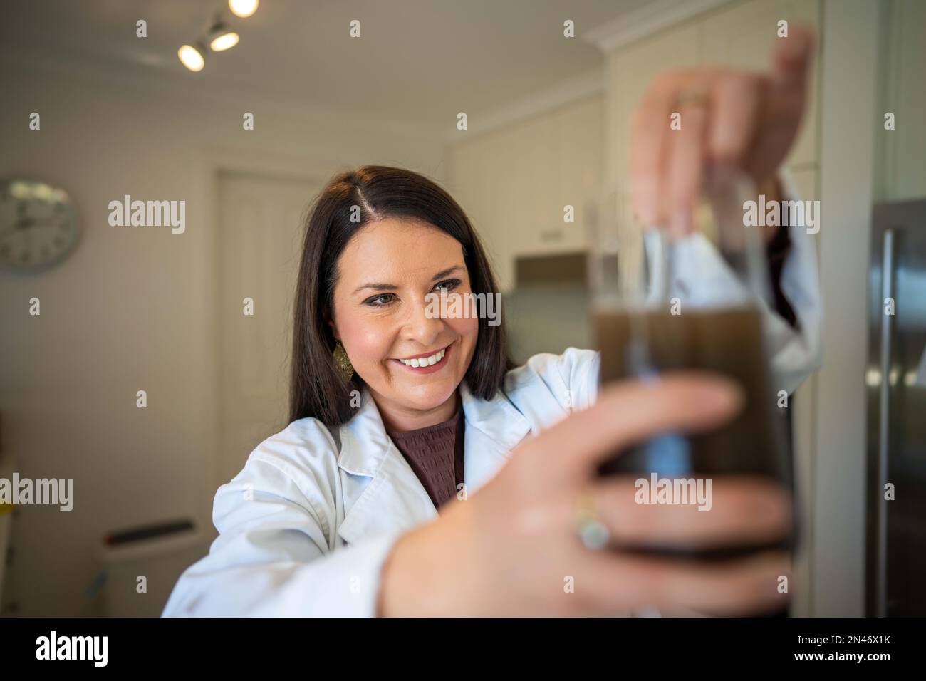 Soil test, female agricultural scientist conducting a soil test in a ...