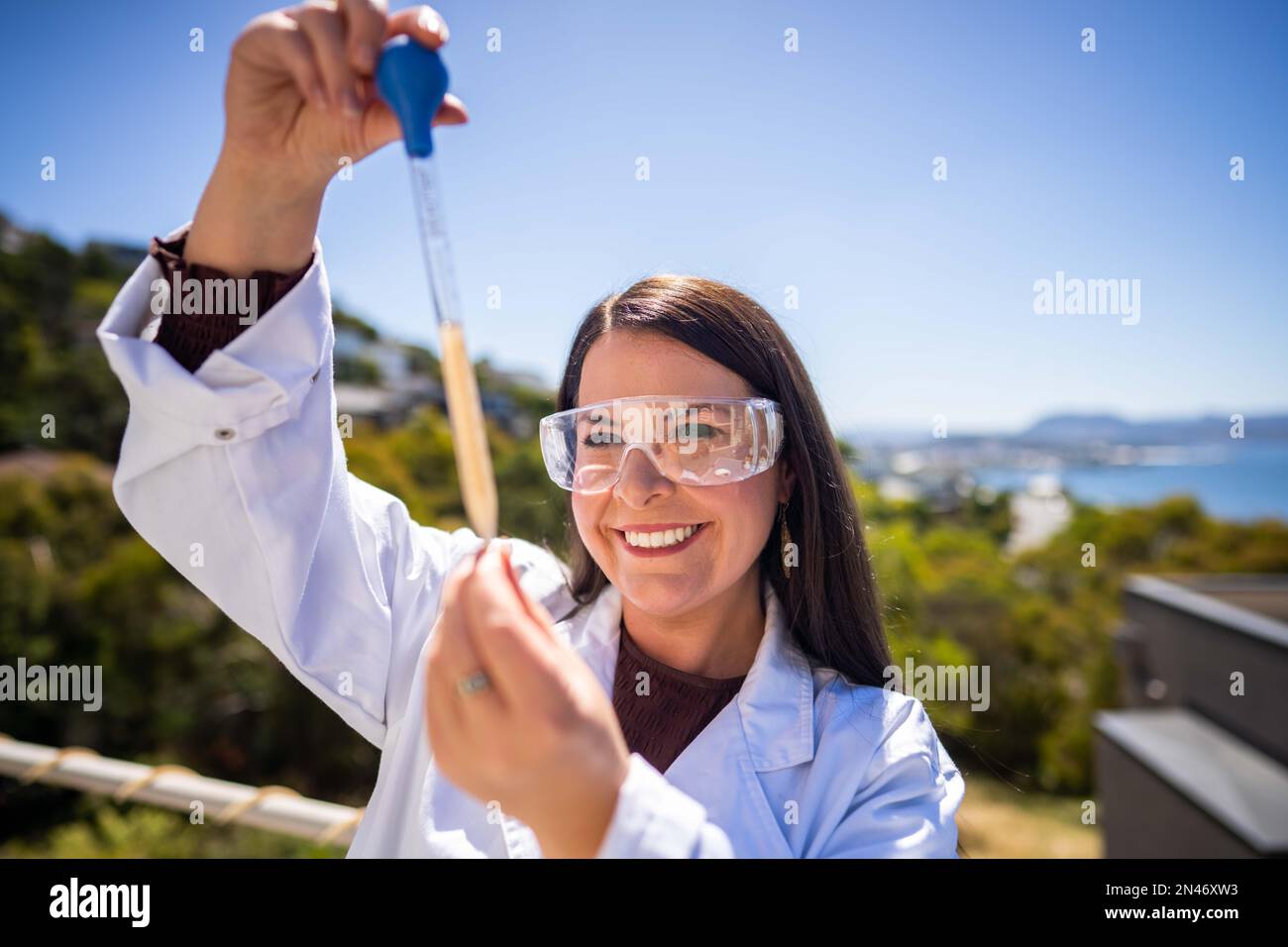 soil scientist agronomist farmer looking at soil samples and grass in a ...