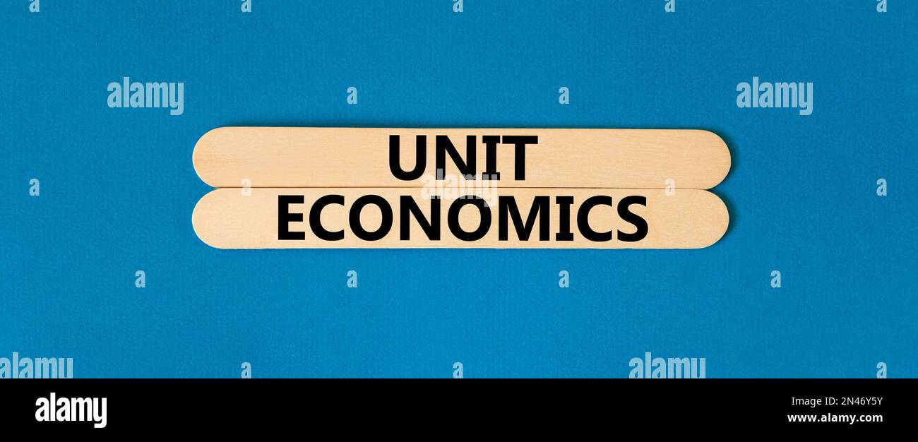 Unit economics symbol. Concept words Unit economics on wooden stick ...