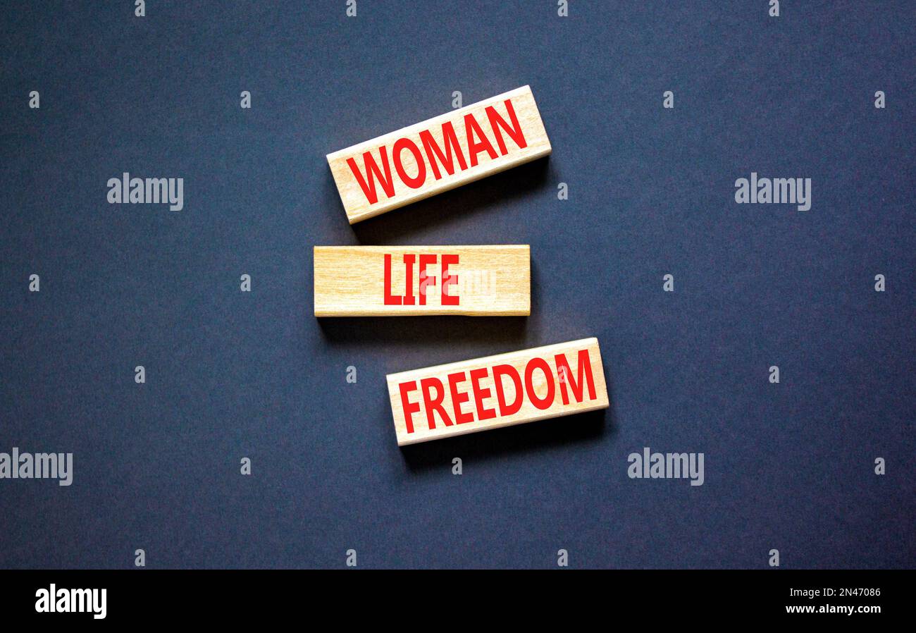 Woman life freedom symbol. Concept words Woman Life Freedom on wooden ...
