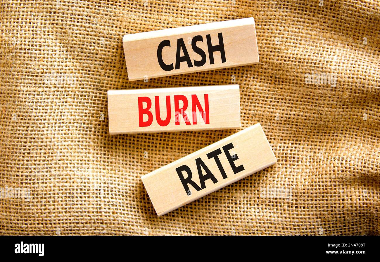 Cash burn rate symbol. Concept words Cash burn rate on wooden blocks on ...