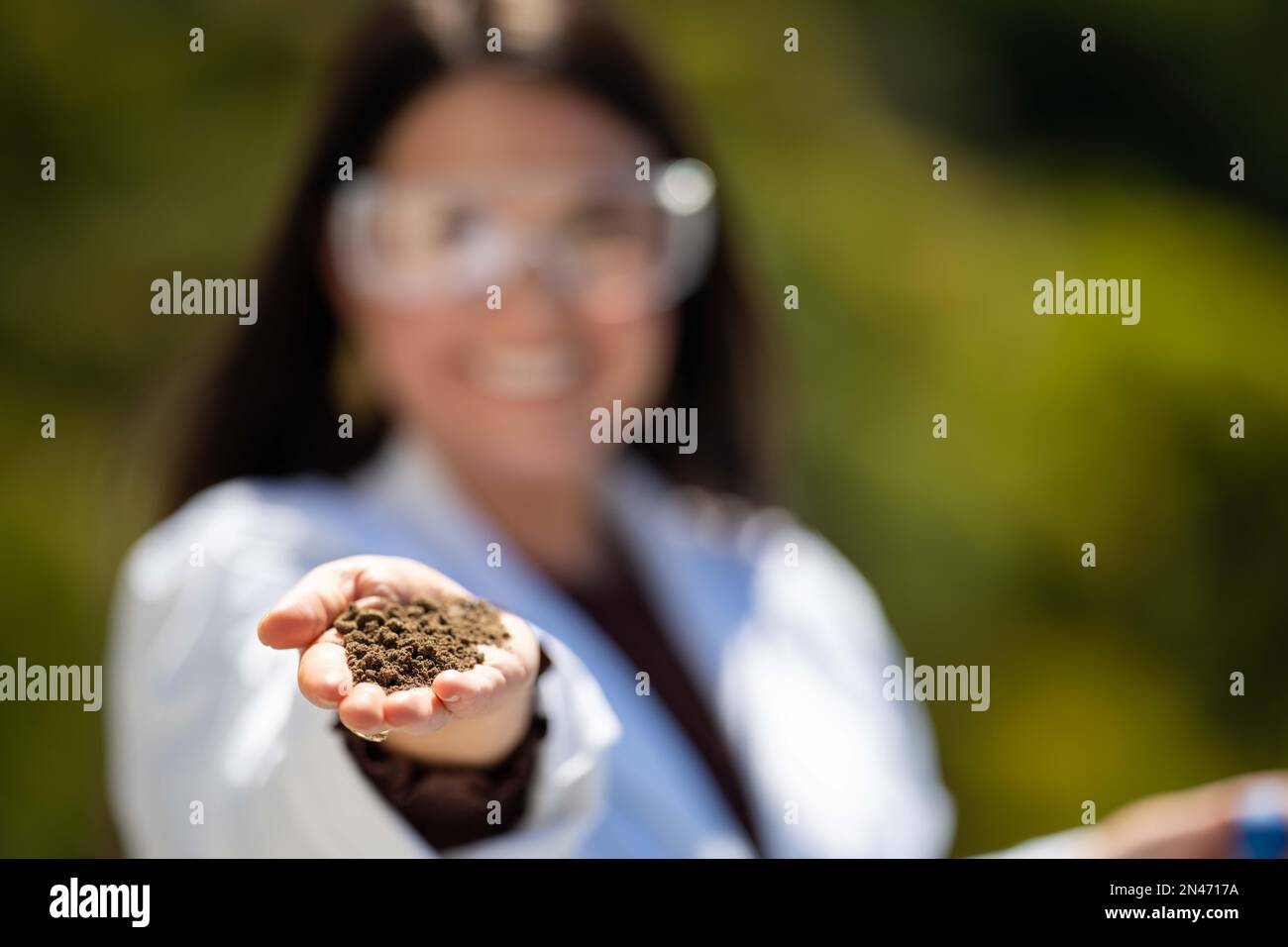Soil test, female agricultural scientist conducting a soil test in a ...