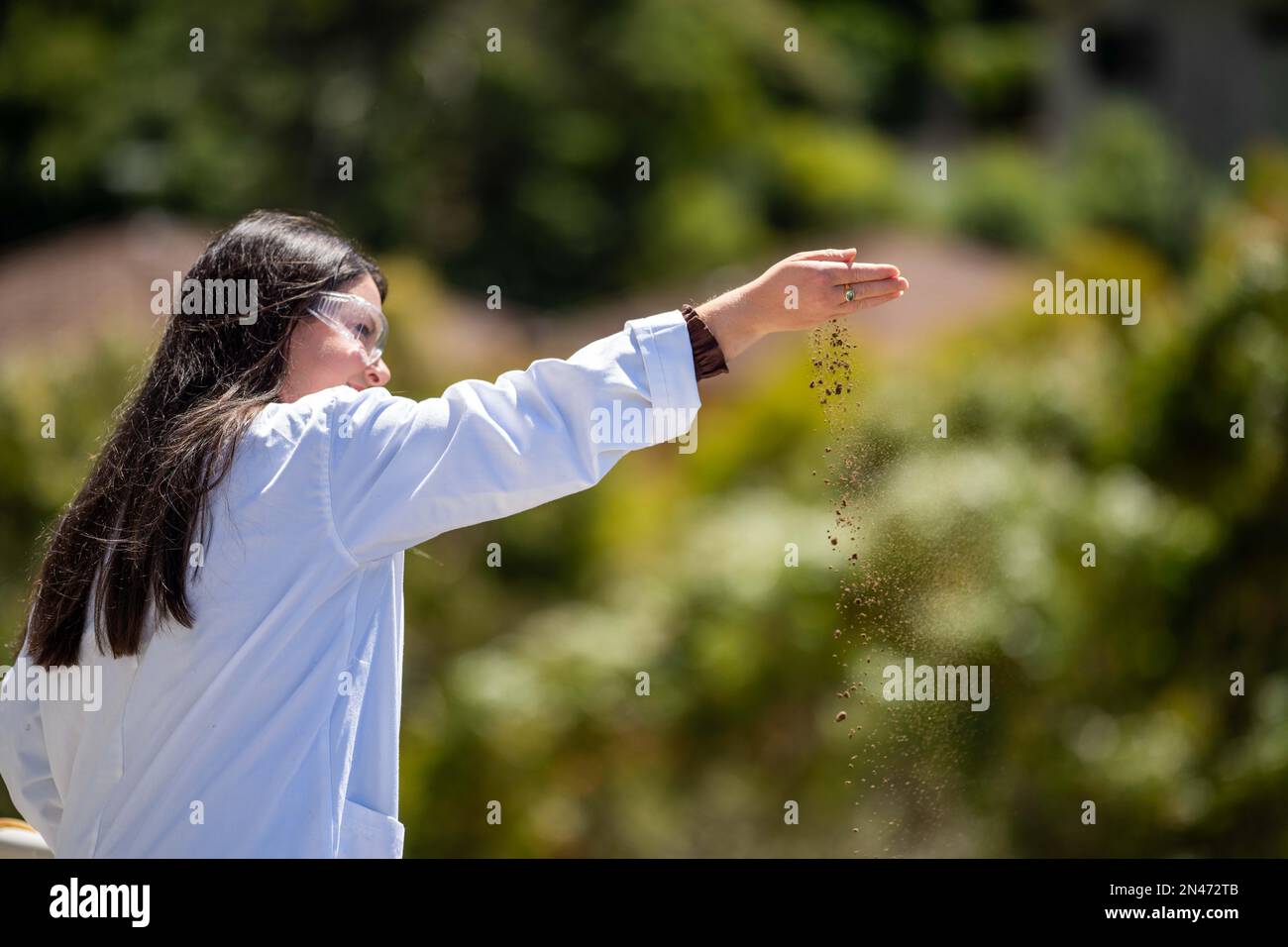 Soil test, female agricultural scientist conducting a soil test in a ...