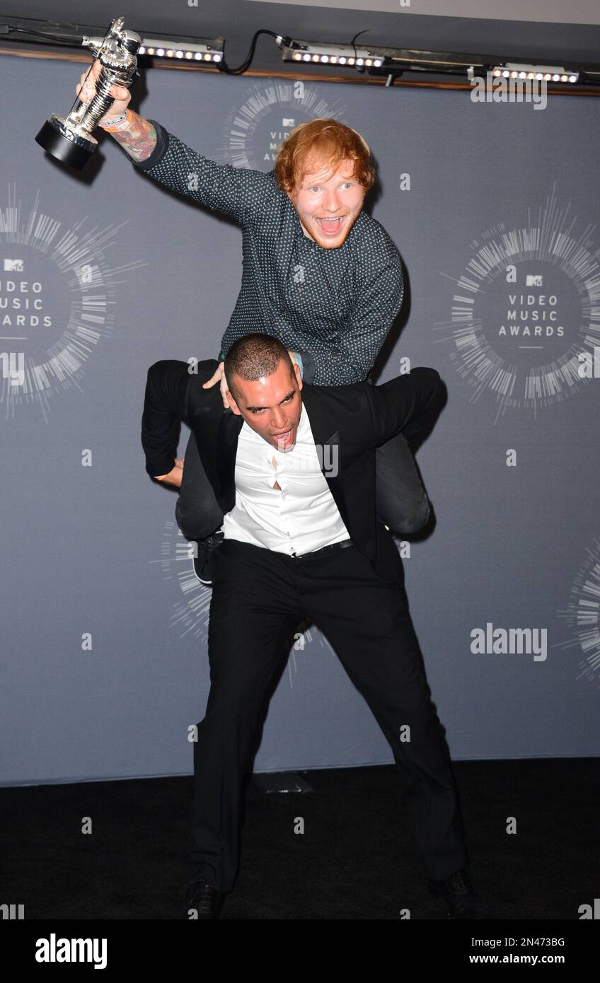 Ed Sheeran, top, and Emil Nava pose with the award for Best Male Video ...