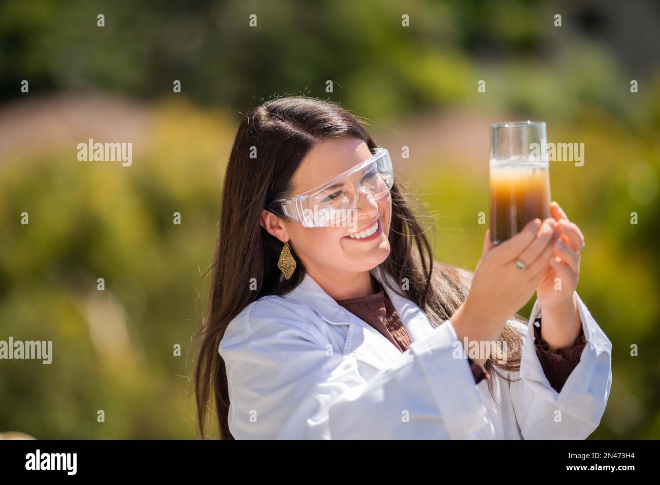 Female scientist working in a science laboratory conduction research ...