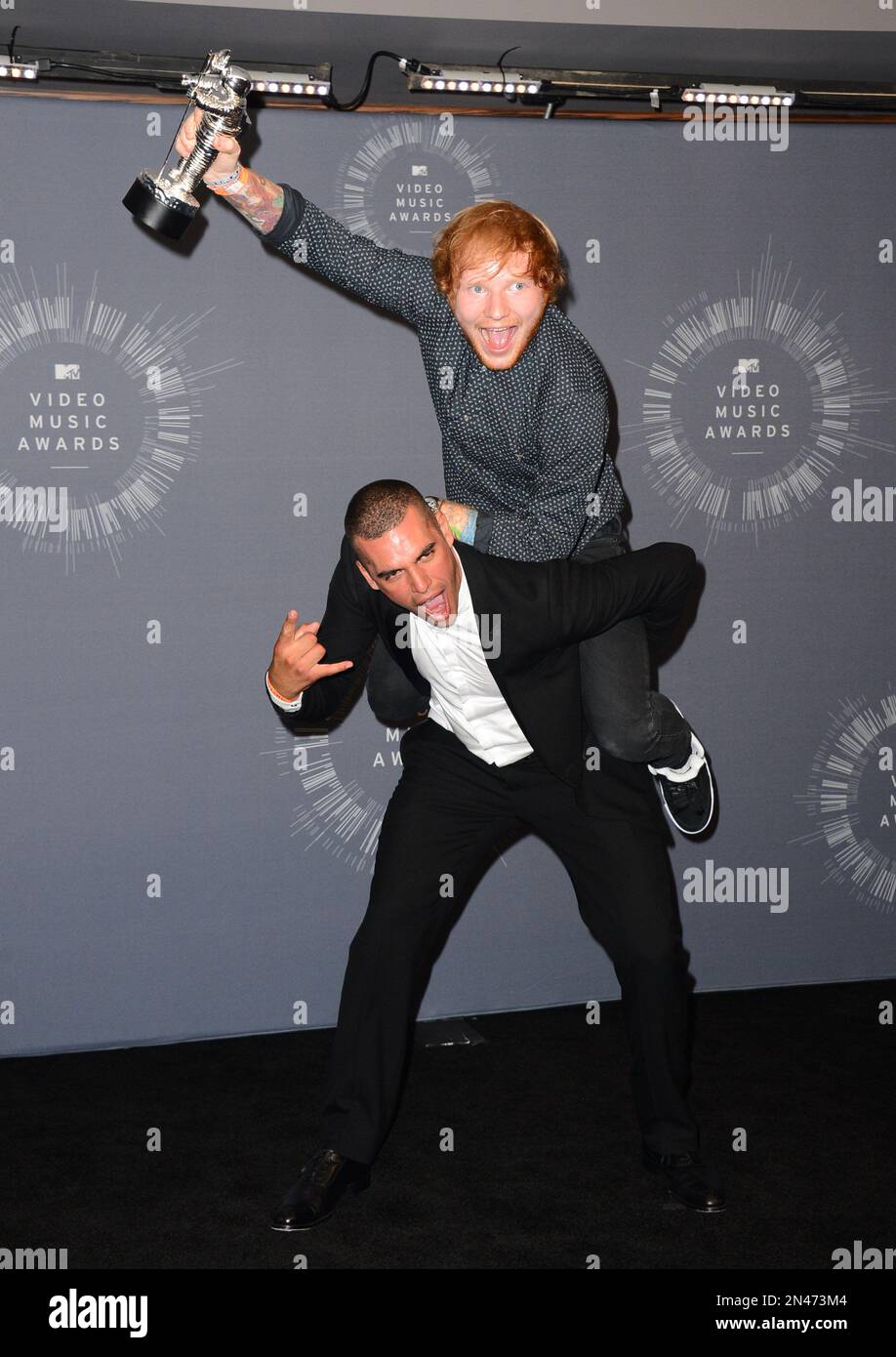 Ed Sheeran, top, and Emil Nava pose with the award for Best Male Video ...