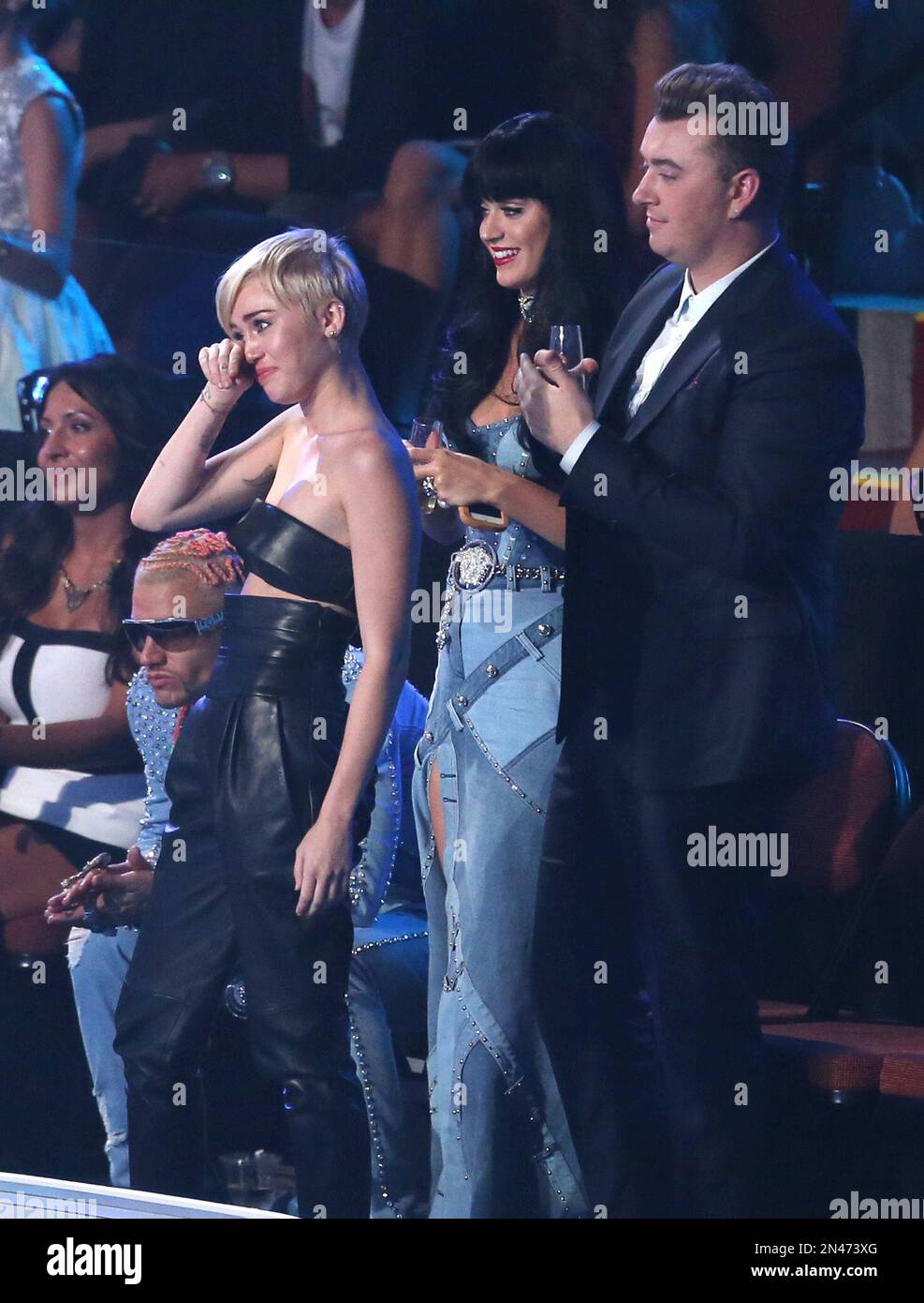 Miley Cyrus, left, accepts the award for Video of the Year at the MTV ...
