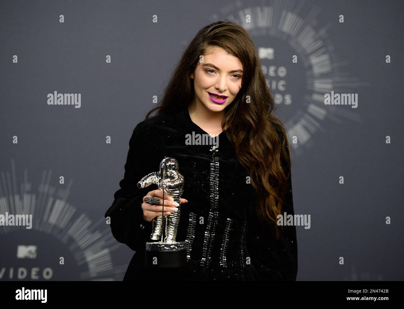 Lorde poses in the press room with the award for Best Rock Video at the ...