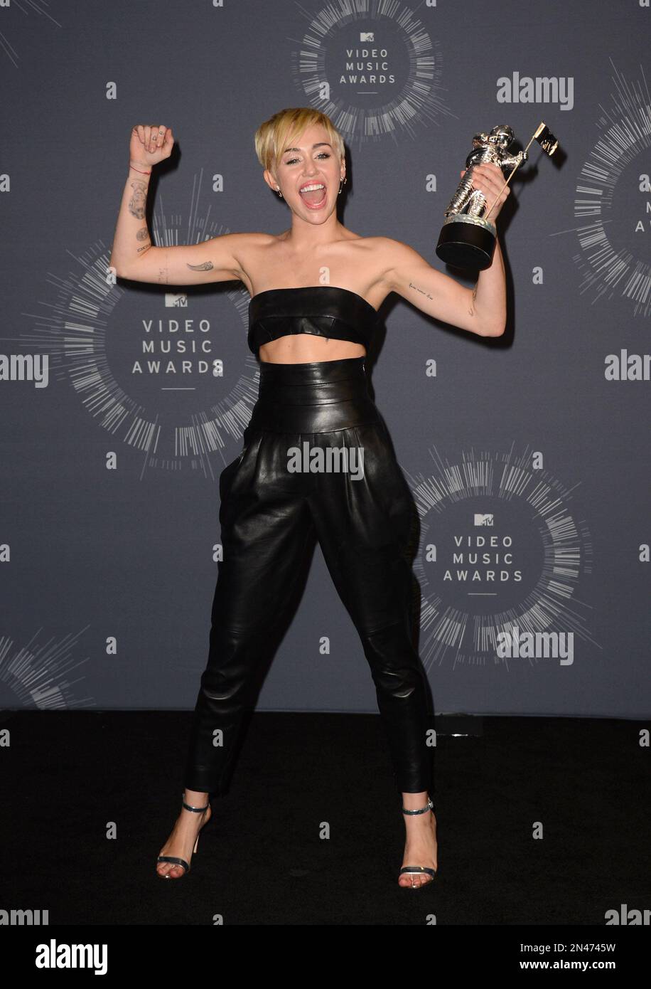 Miley Cyrus poses with the award for Video of the Year in the press ...