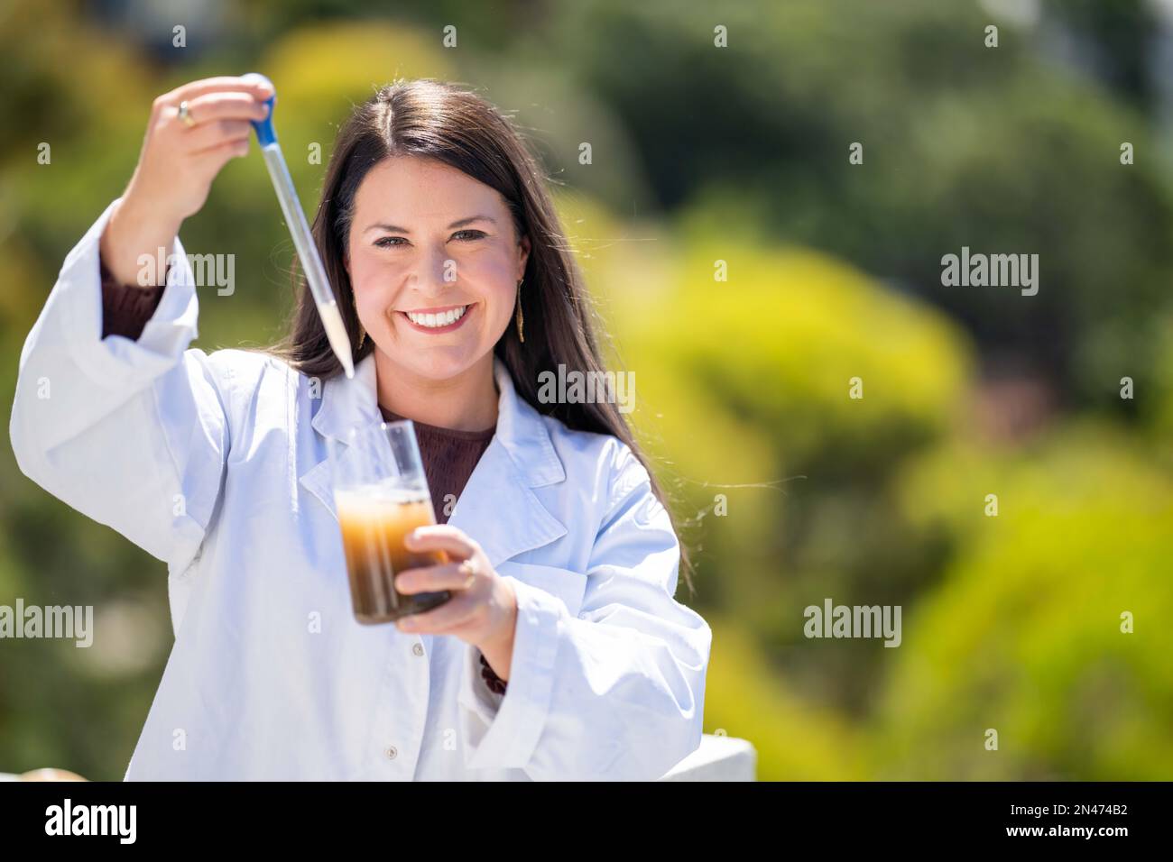 Soil test, female agricultural scientist conducting a soil test in a ...