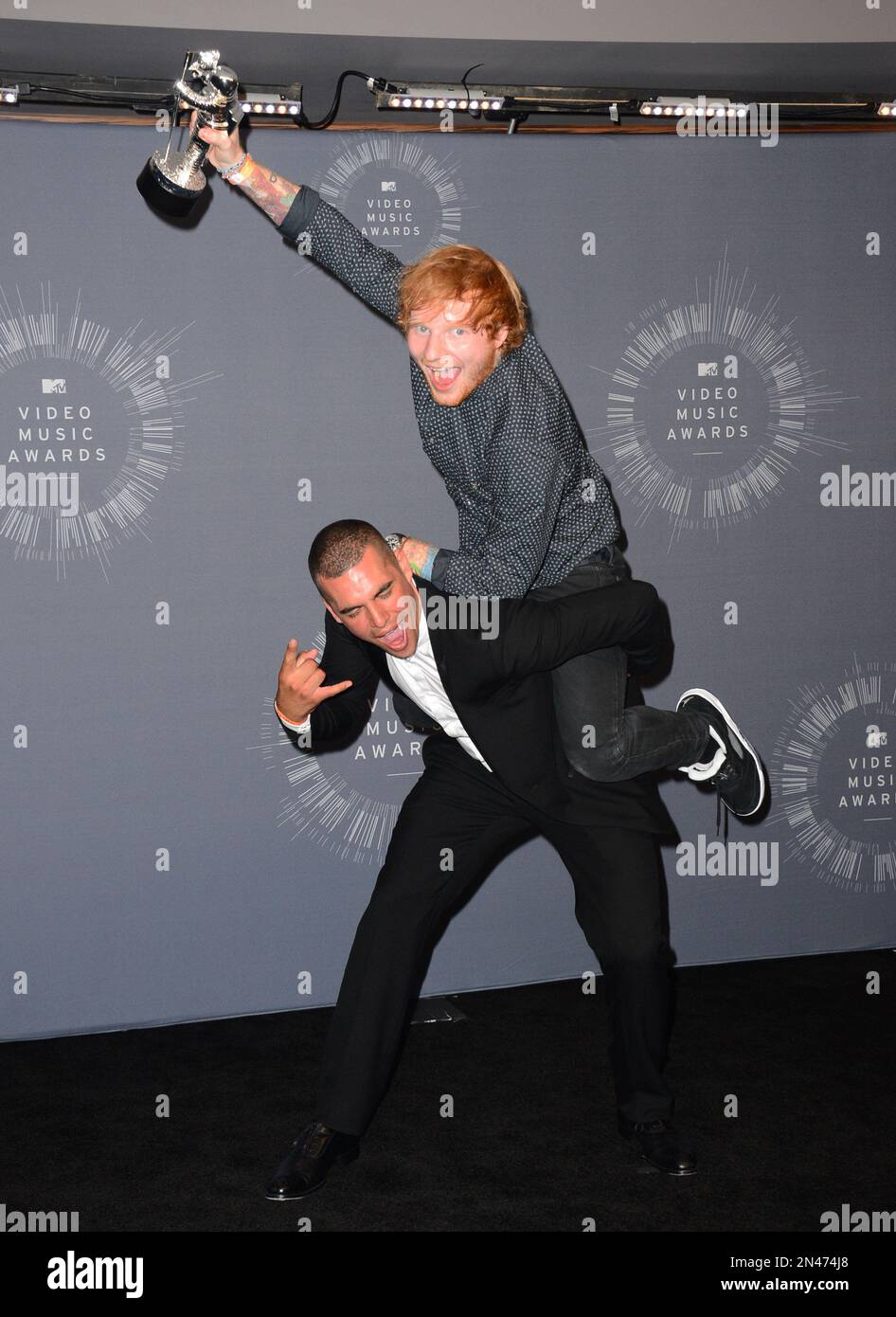 Emil Nava, left, and Ed Sheeran pose with the award for Best Male Video ...