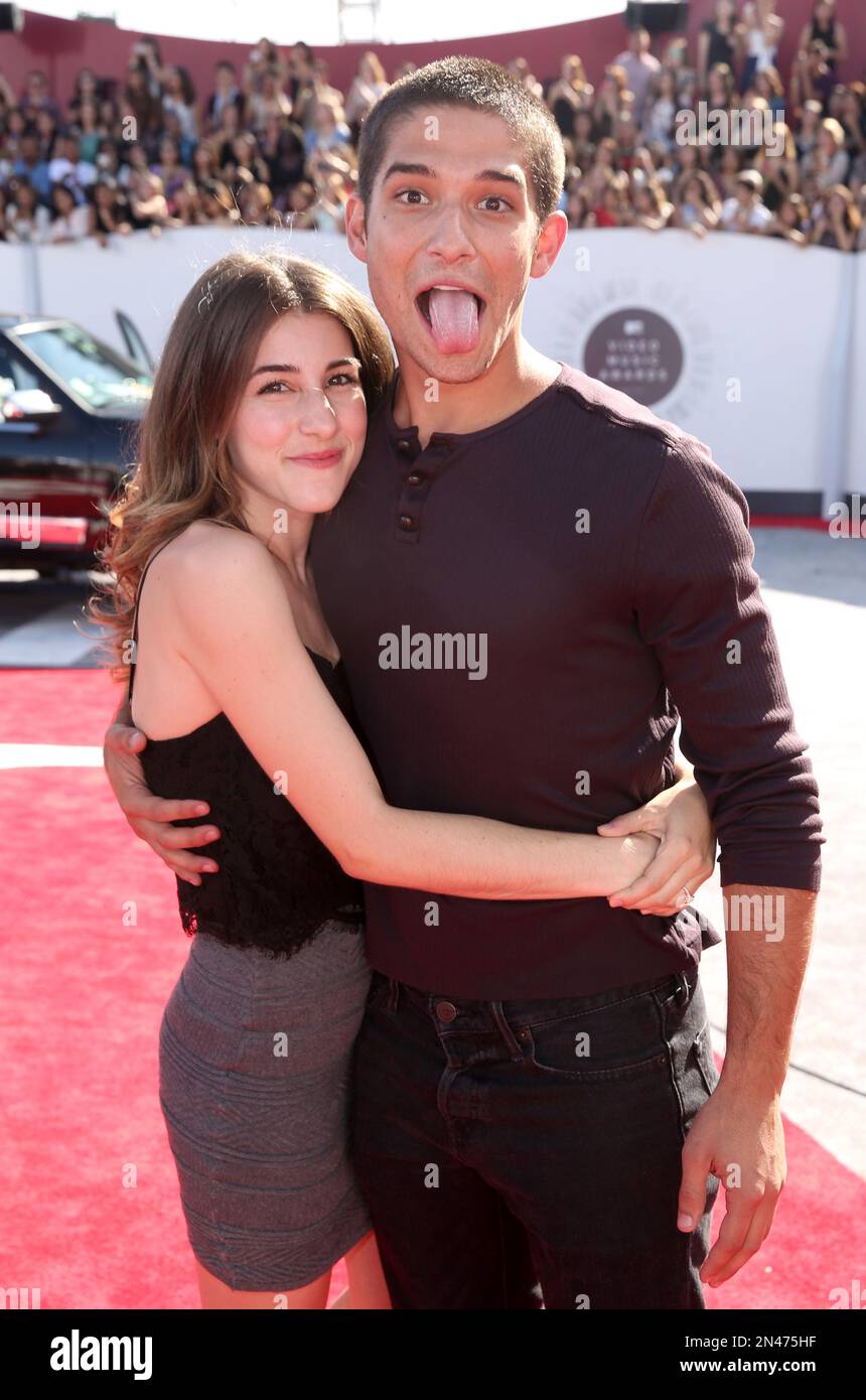 Seana Gorlick, left, and Tyler Posey arrive at the MTV Video Music ...